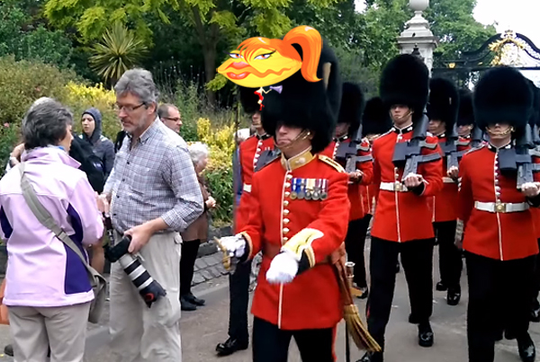 Get out of the way!! Tourist is barged aside by The Queen’s guardsmen ...